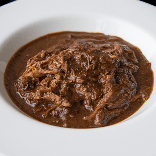 Pollo deshebrado en mole avellanado - The Bag